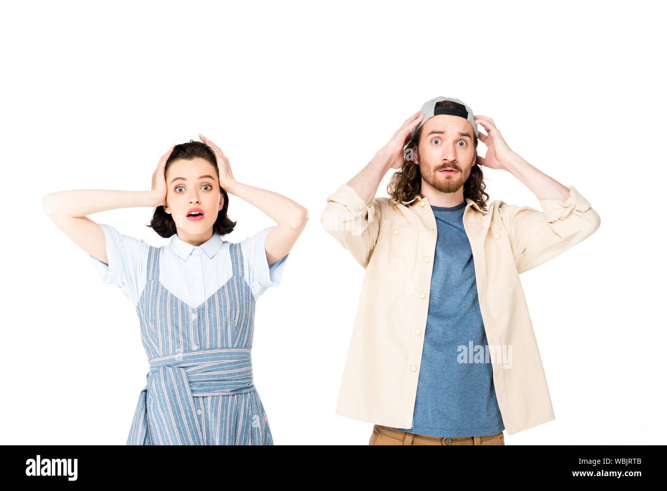 shocked two people holding heads with hands isolated on white Stock ...