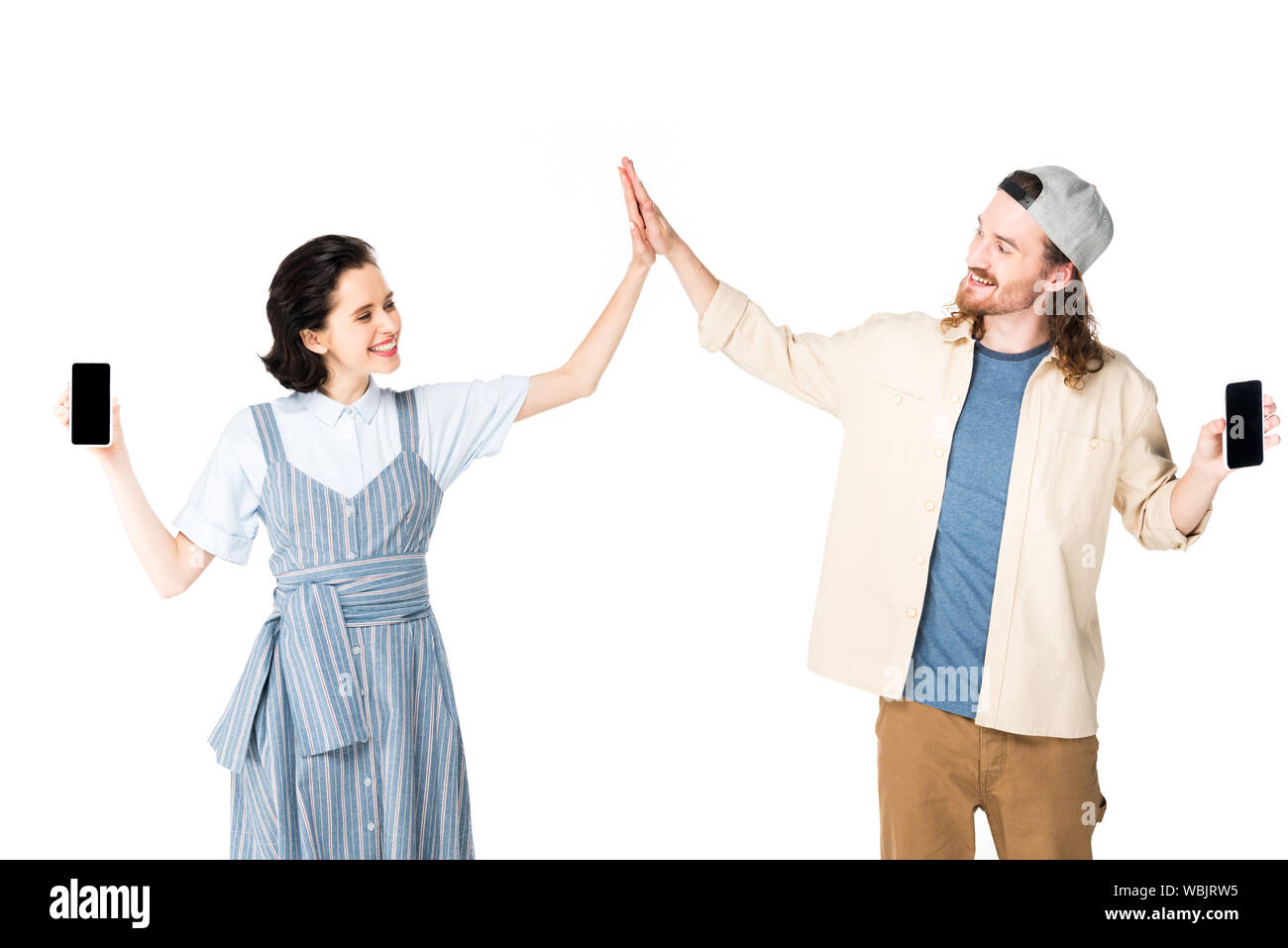 two people holding smartphones in hands and giving high five isolated ...