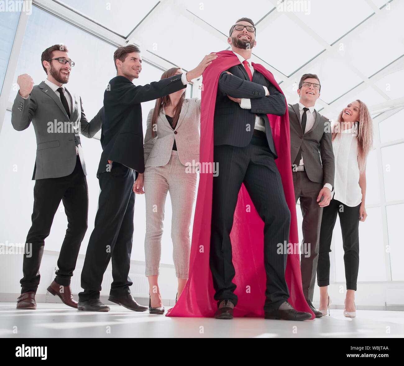 boss is a superhero and the business team is standing together Stock ...