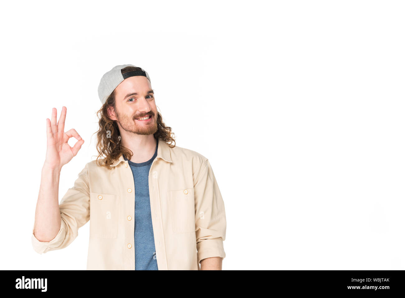 handsome young man showing OK sign at camera isolated on white Stock ...