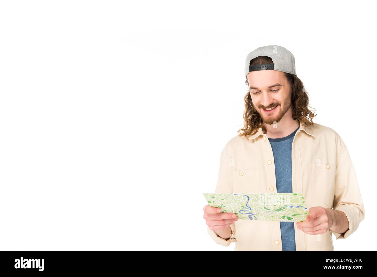 young man looking at map and smiling isolated on white Stock Photo - Alamy