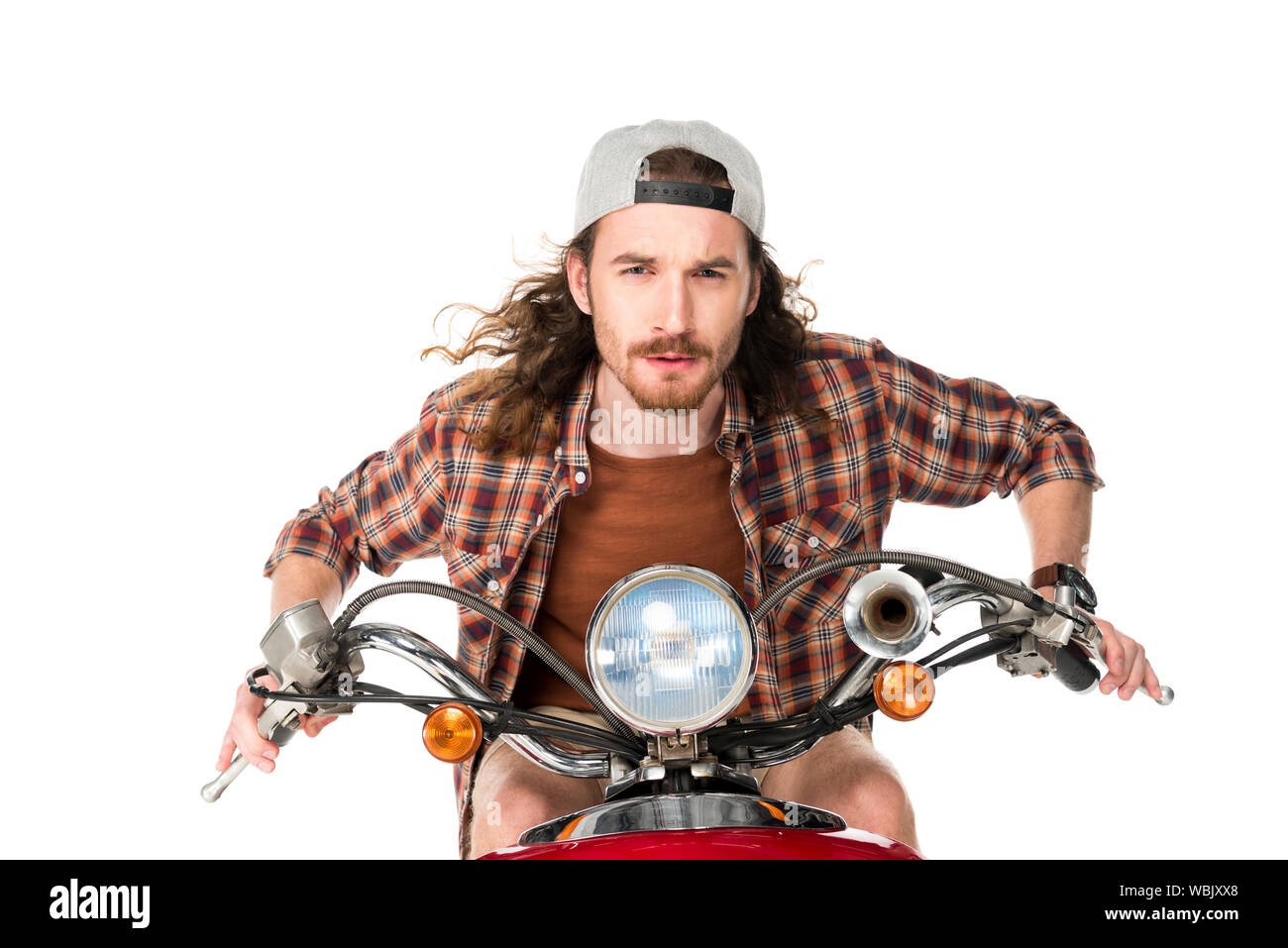 front view of young man riding on red scooter isolated on white Stock ...