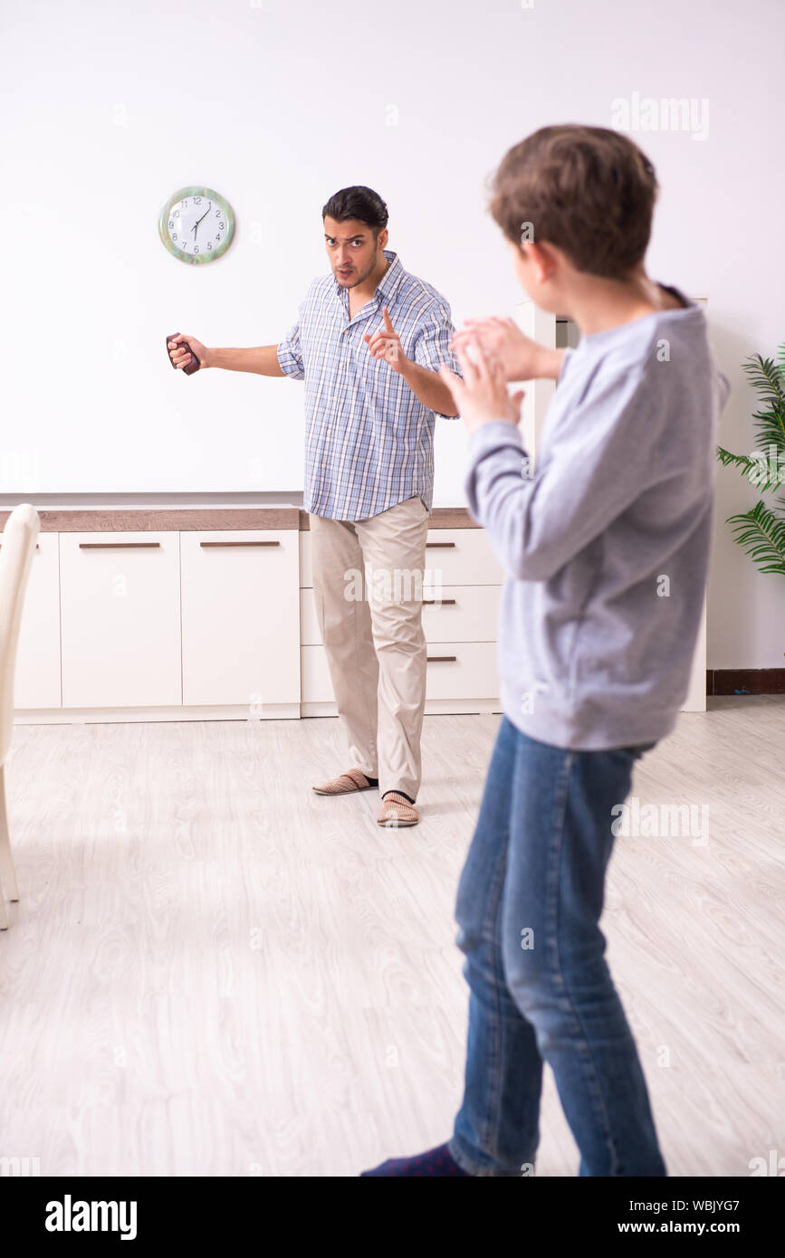 The father beating and punishing his sone Stock Photo - Alamy