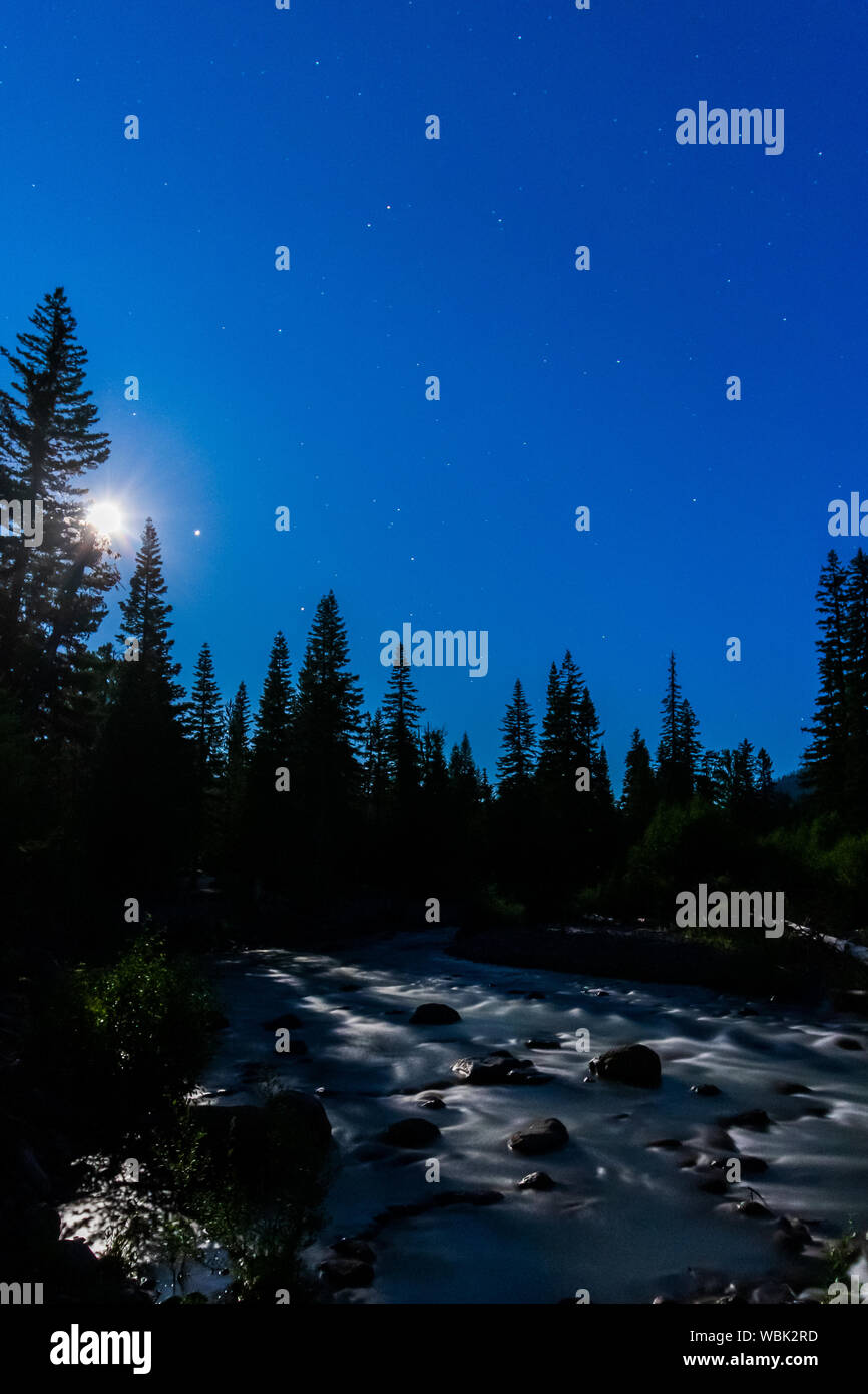 Full Moon Shines On Flowing River Stock Photo - Alamy