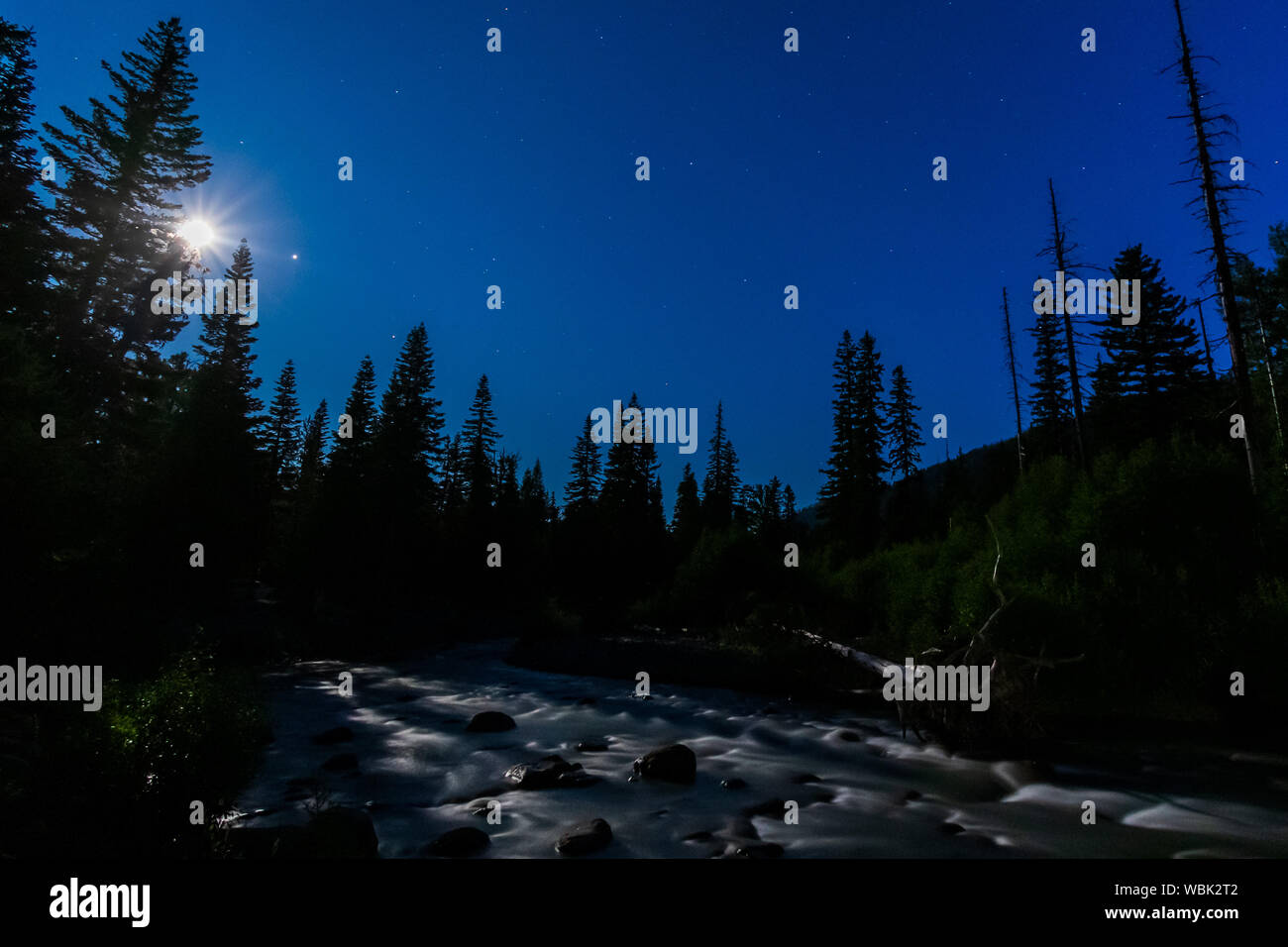 Full Moon Shines On Flowing River Stock Photo - Alamy