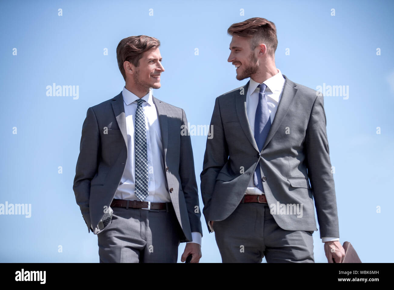 confident business partners walking together Stock Photo - Alamy
