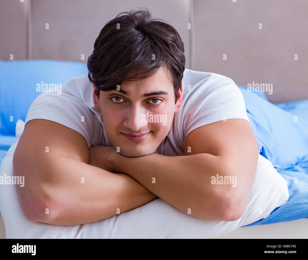 The man suffering from insomnia lying in bed Stock Photo - Alamy