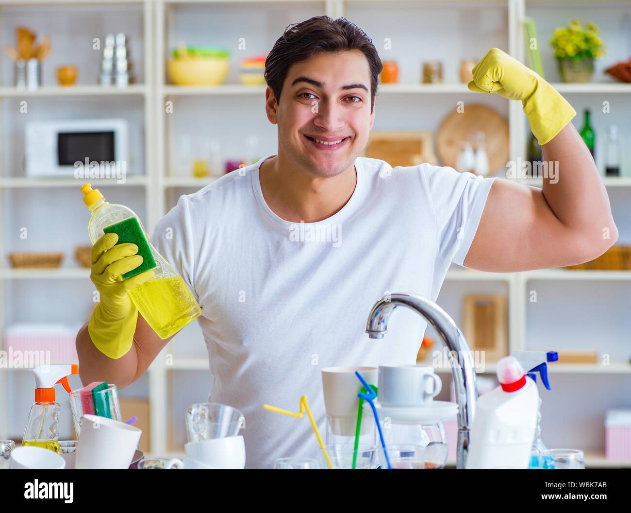 The good husband washing dishes at home Stock Photo - Alamy
