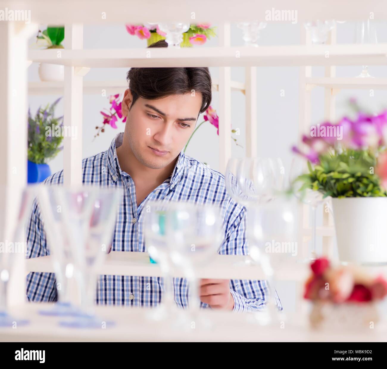 The young handsome man shopping in shop Stock Photo - Alamy
