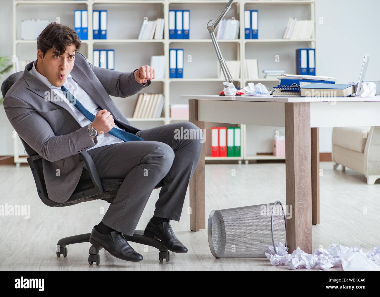 The businessman having fun taking a break in the office at work Stock ...