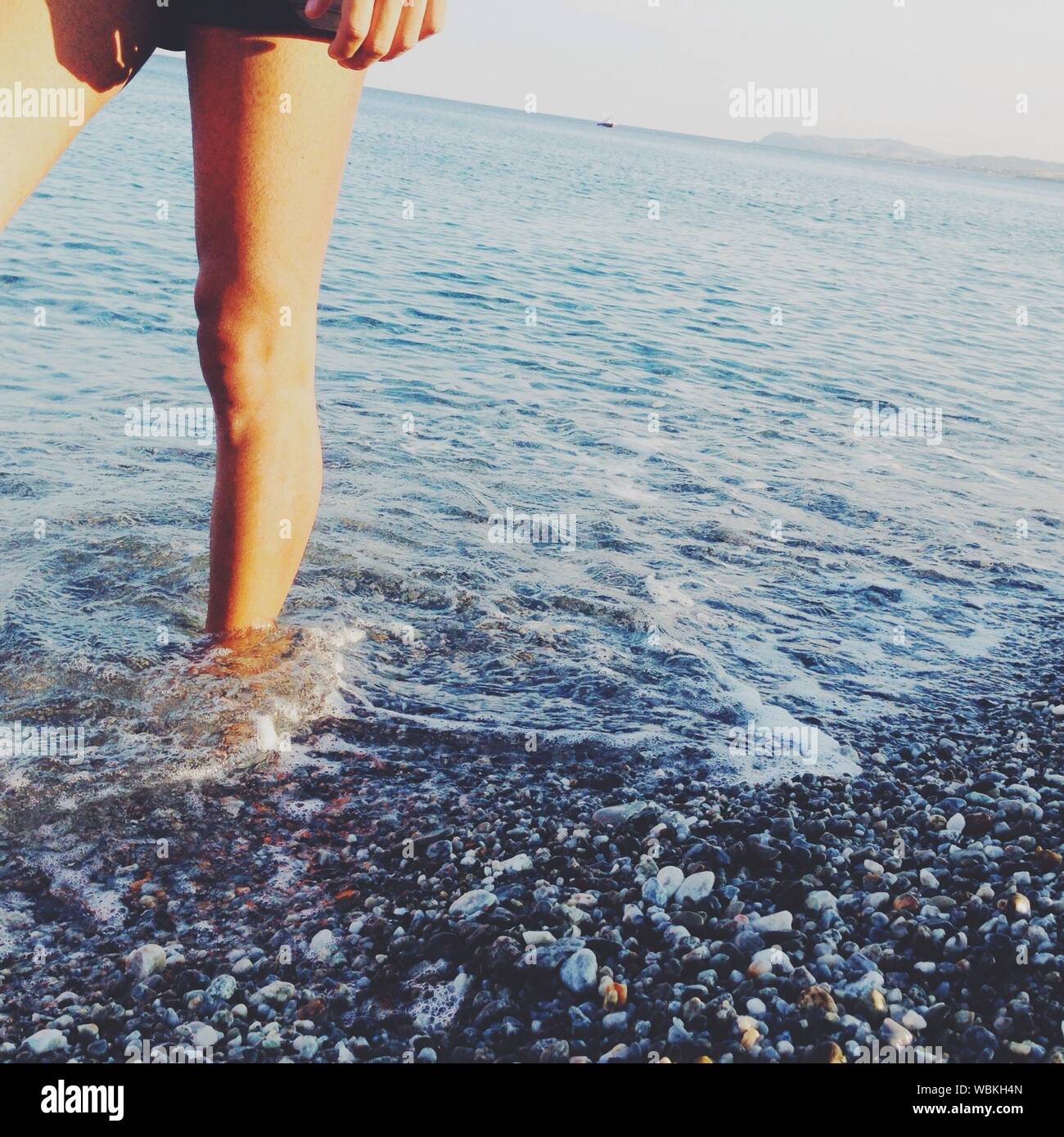 Person standing in water hi-res stock photography and images - Alamy