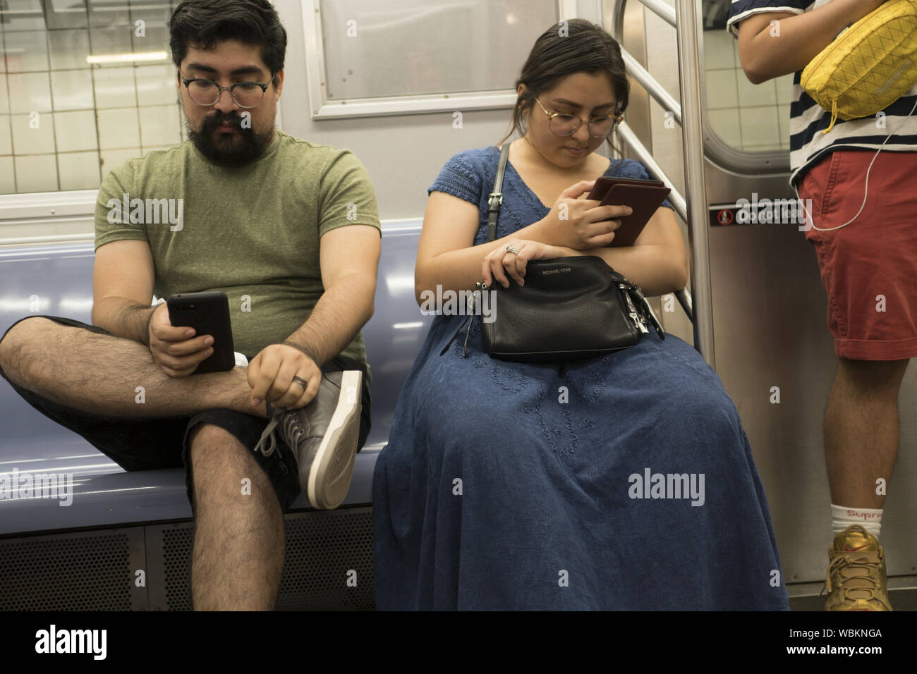 People sitting on nyc subway train hi-res stock photography and images ...