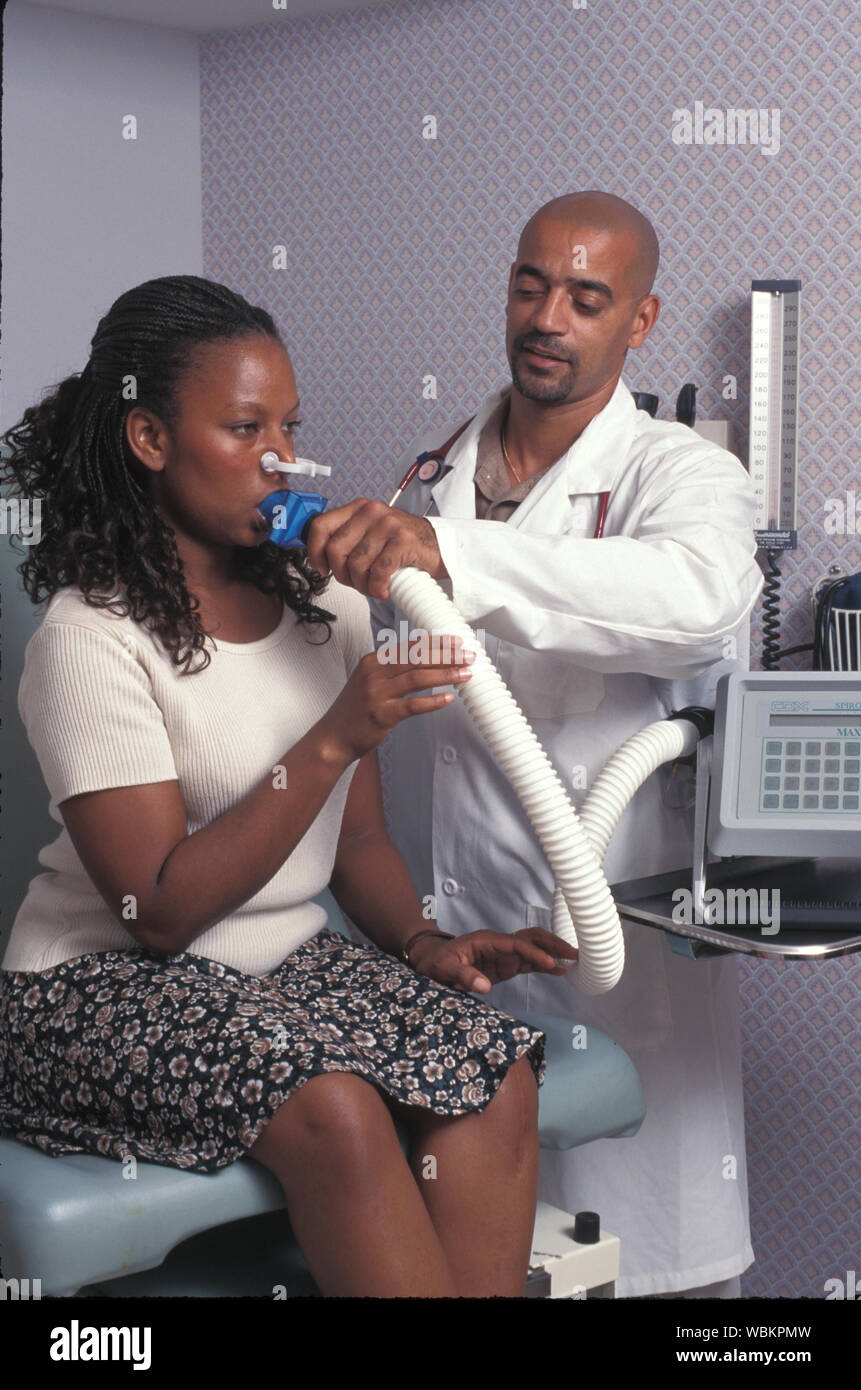 Medical technician administers a lung test at a New York City hospital ...