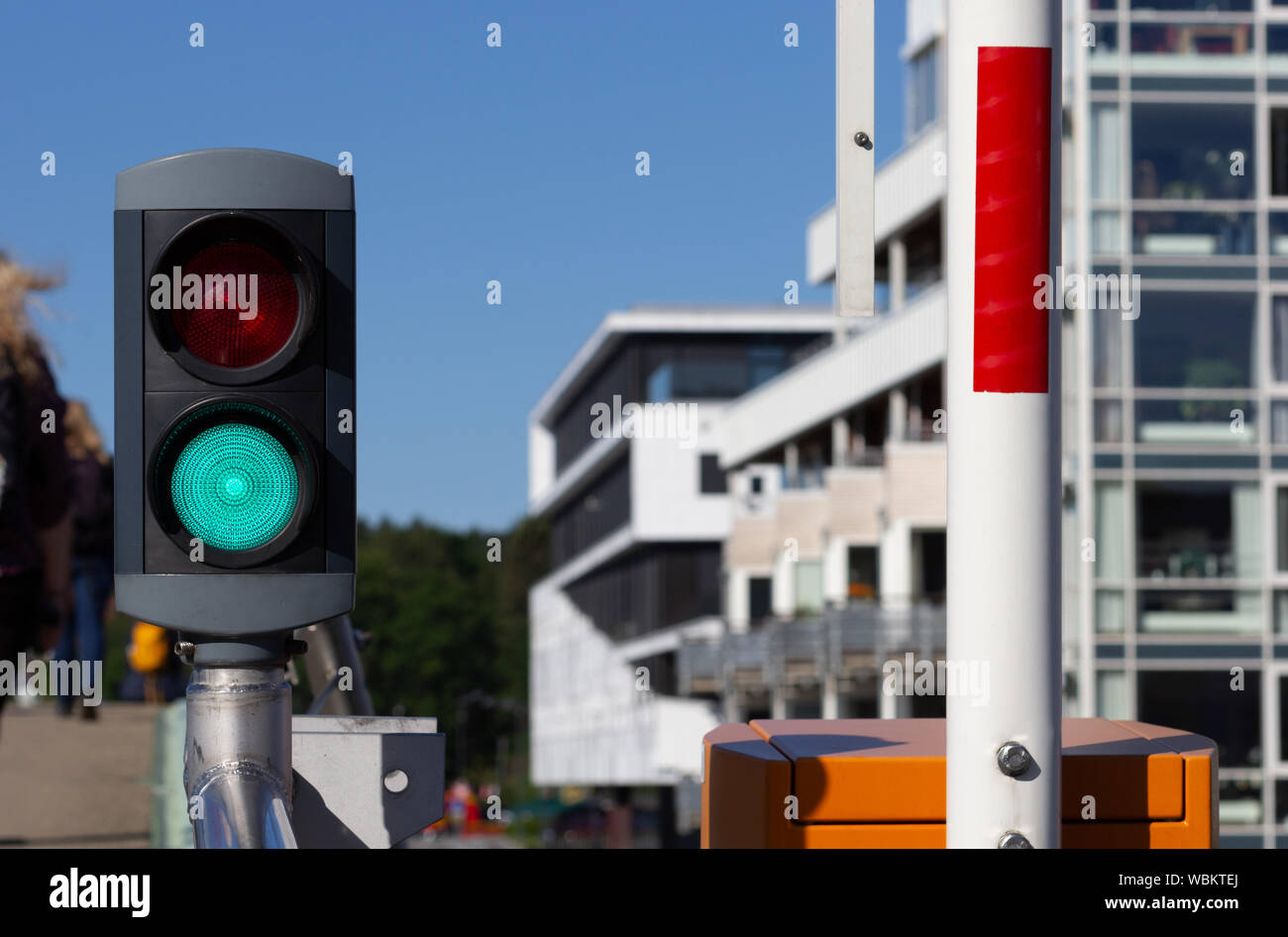 River traffic light for ferry boats with green light on the bridge ...