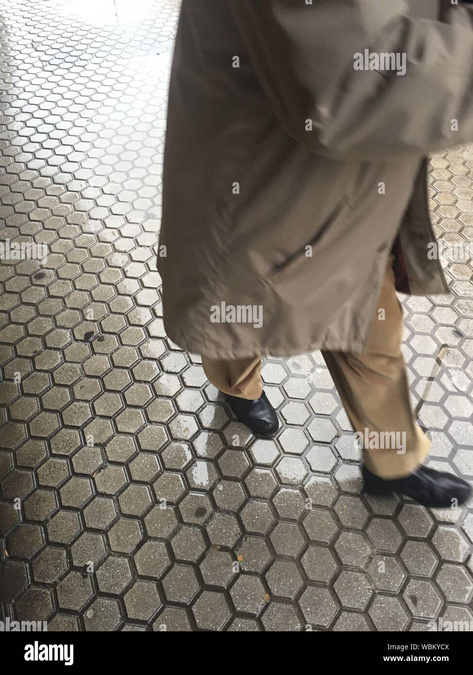 Man walking on paving hi-res stock photography and images - Alamy