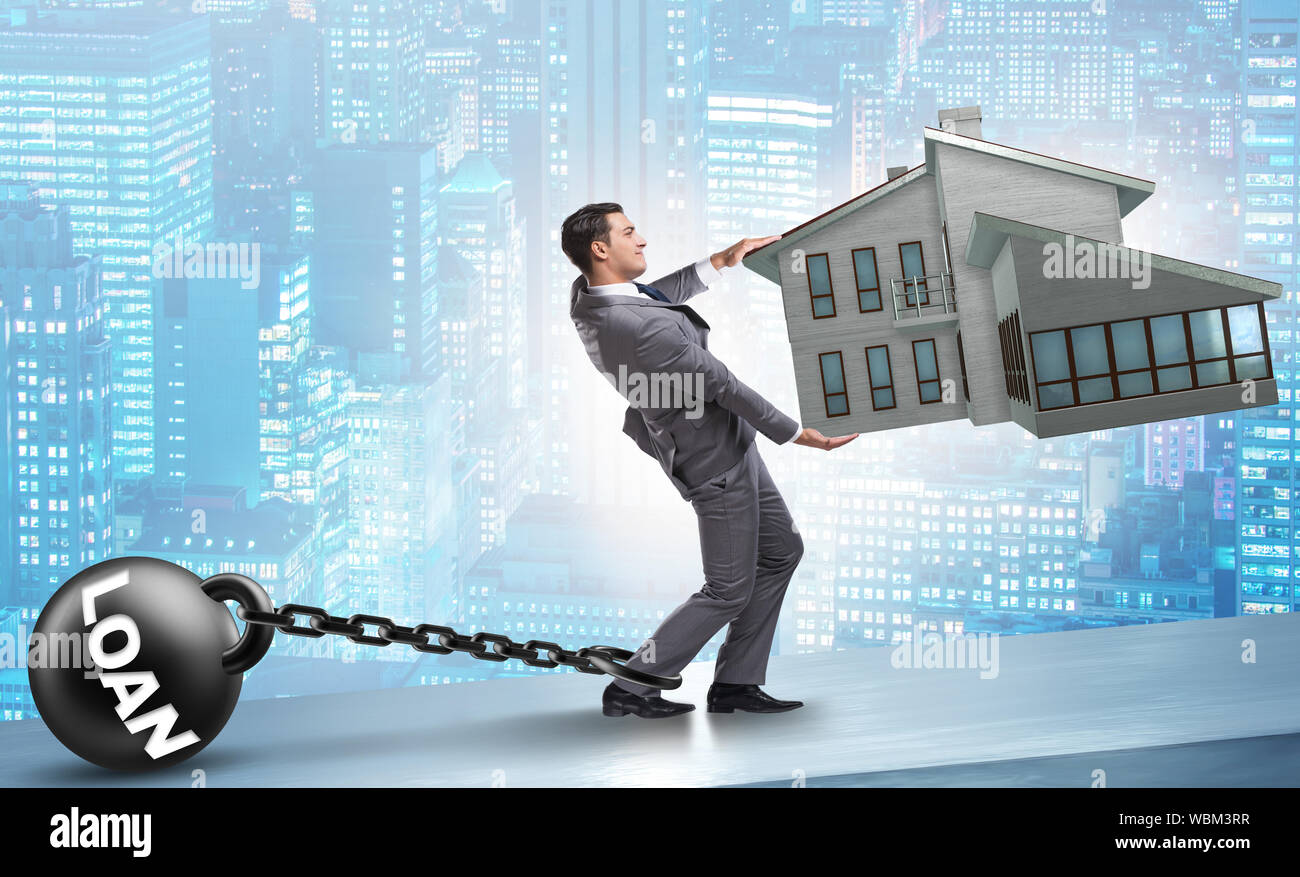The businessman in mortgage debt financing concept Stock Photo - Alamy