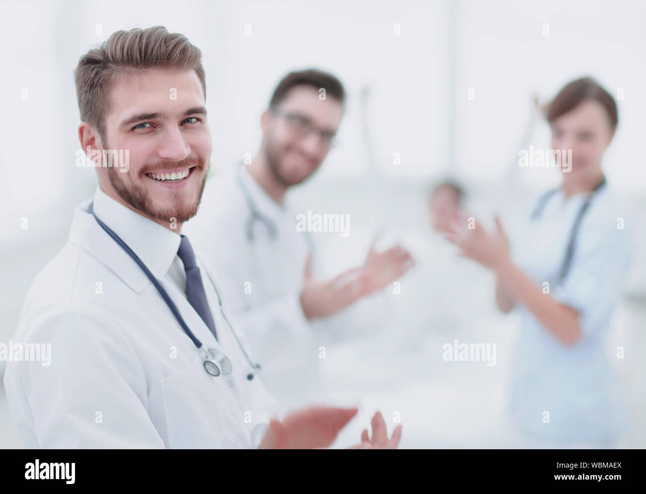 Doctors clapping hands and applauding on consent Stock Photo - Alamy