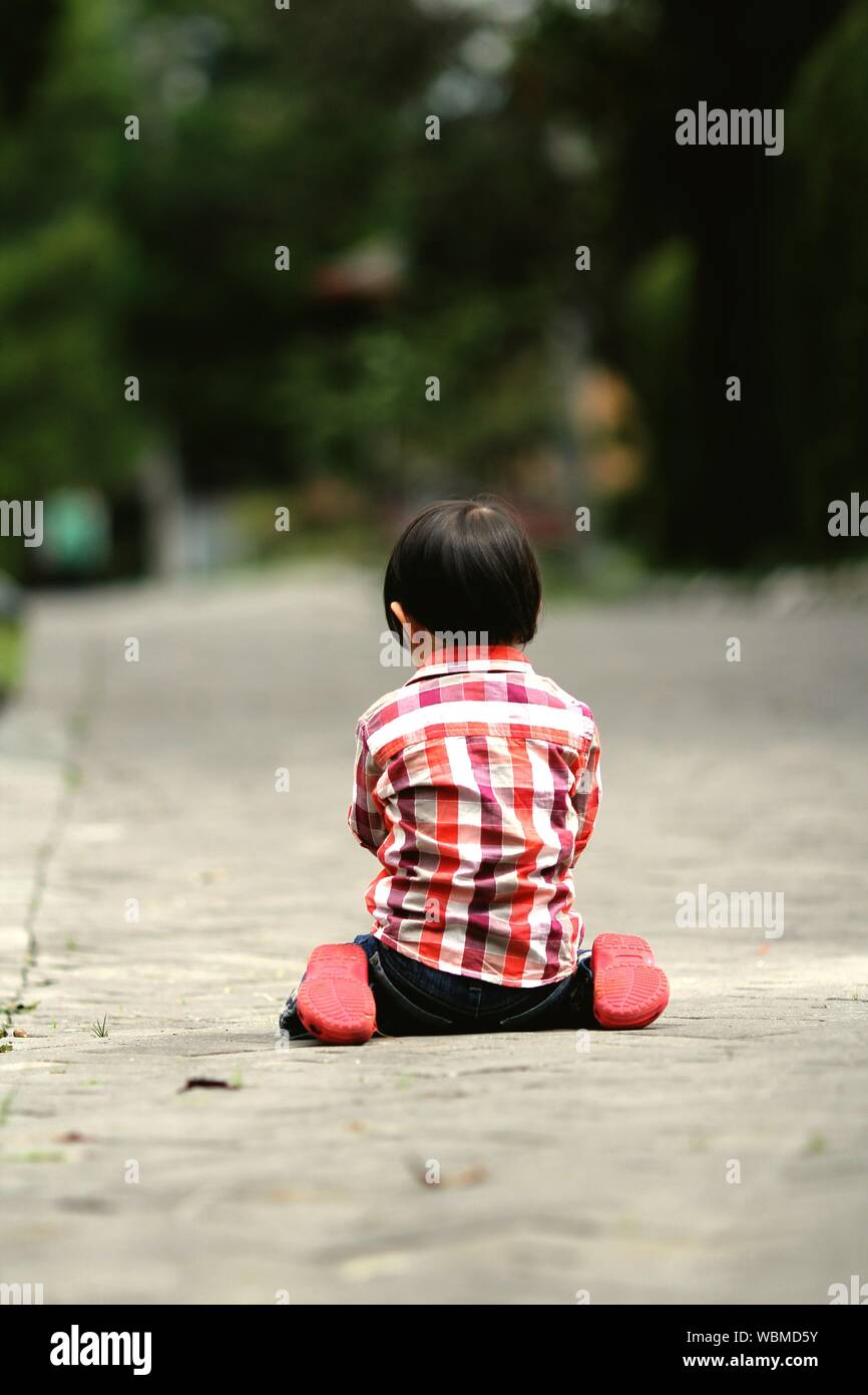 Child Kneeling Rear View High Resolution Stock Photography and Images ...