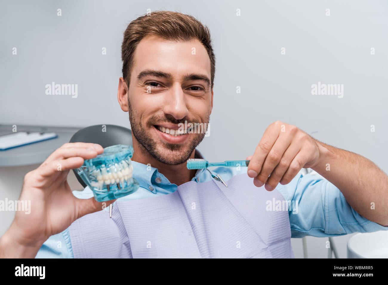 Happy man brushing tooth in hi-res stock photography and images - Alamy