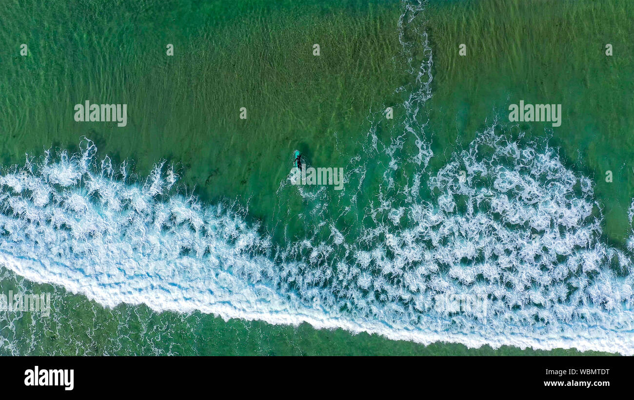 Surfer on Freshwater West Beach in Pembrokeshire, Wales, UK Stock Photo ...