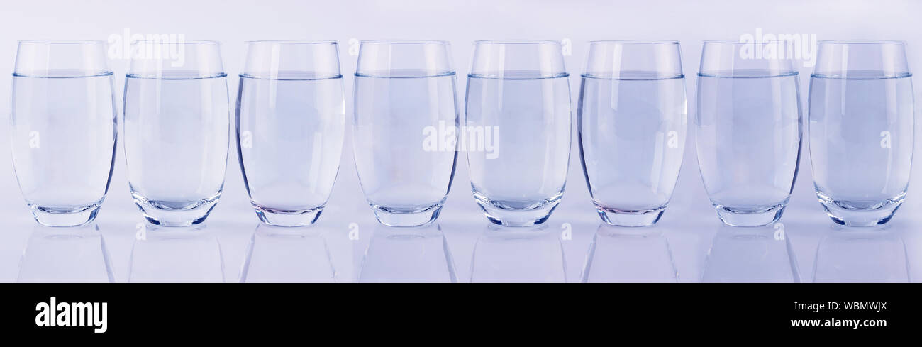 Eight glasses of water Stock Photo - Alamy