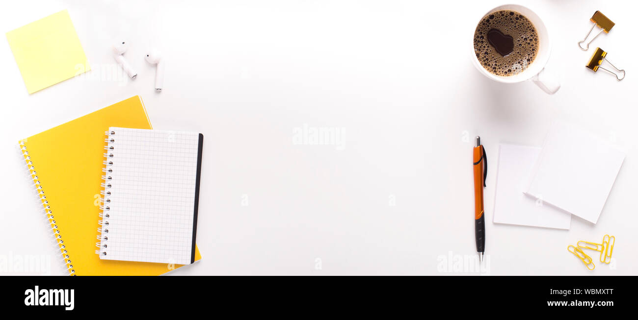 Morning coffee on workplace with yellow stationery and notepad Stock ...