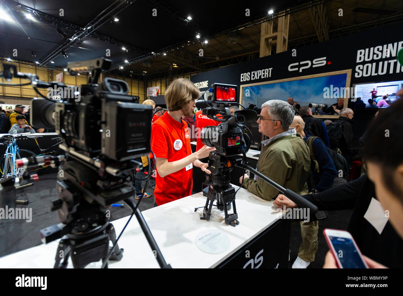 Canon EOS stand, team member talking to visitor, photography show 2019 ...