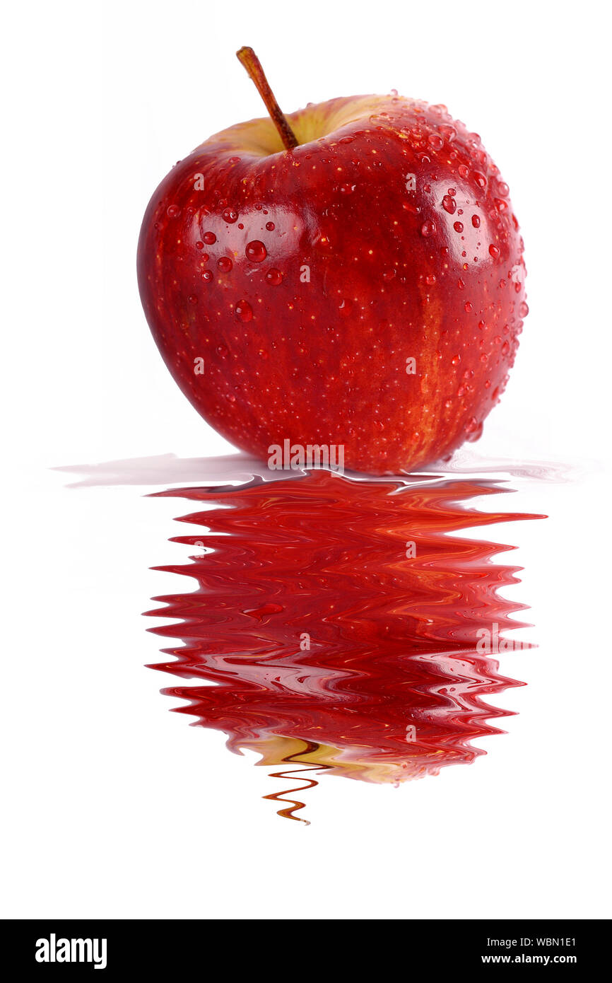 A red apple reflecting in water Stock Photo - Alamy