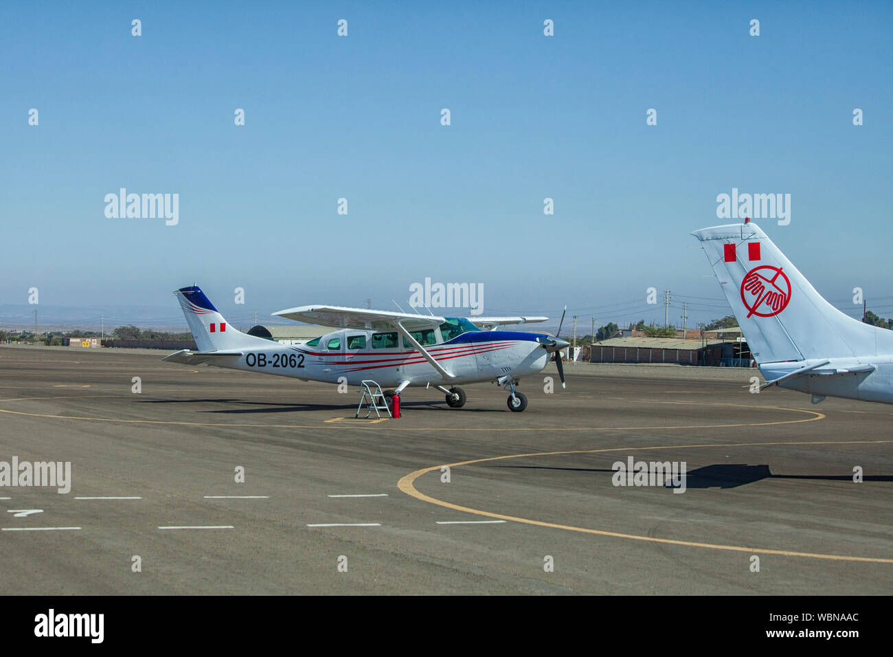 Airplanes waiting for passengers on airport Nazca. Flight over the ...