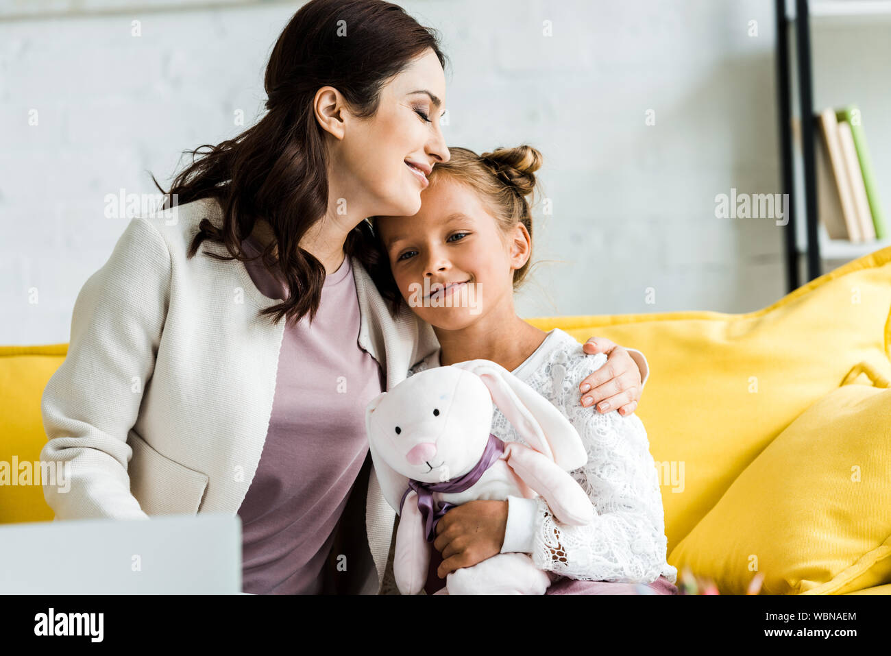 Cute preteen girl sitting hugging hi-res stock photography and images ...