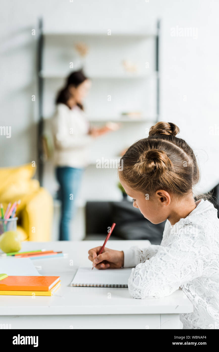 selective focus of cute kid drawing with color pencil Stock Photo - Alamy
