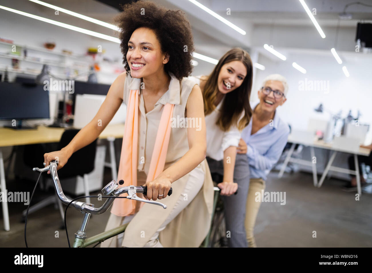 Carefree diverse office workers having fun during work break Stock ...