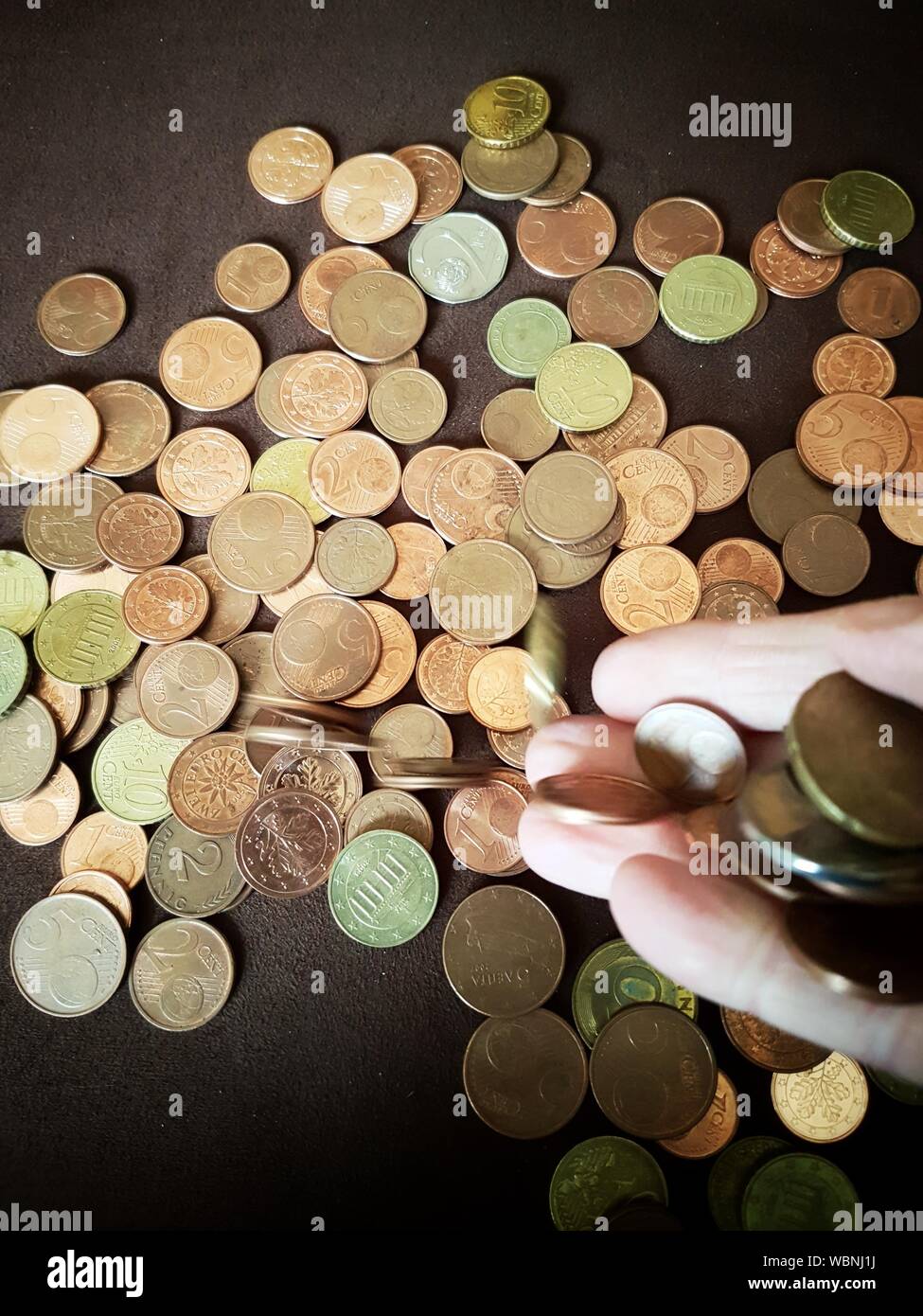 Pouring gold coins hi-res stock photography and images - Alamy