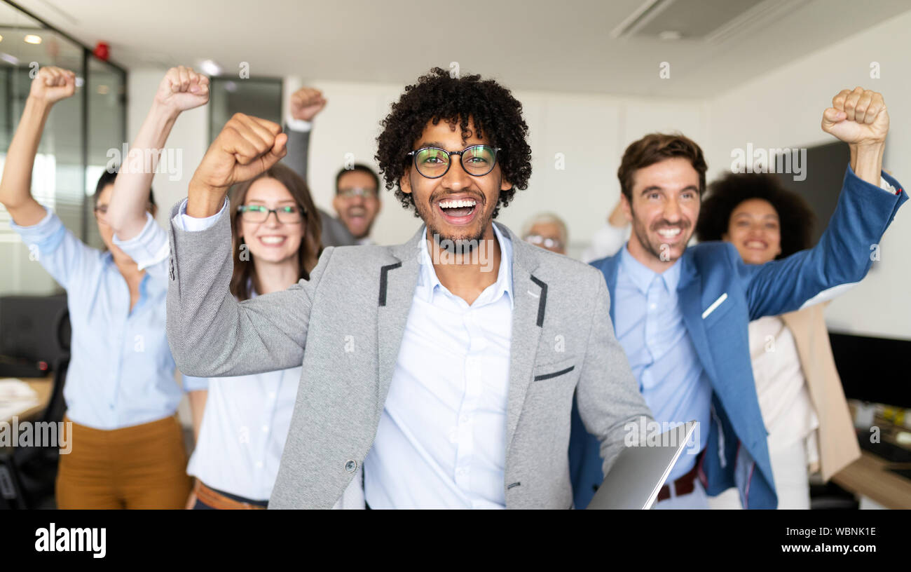 Business team celebrating a good job in the office Stock Photo - Alamy