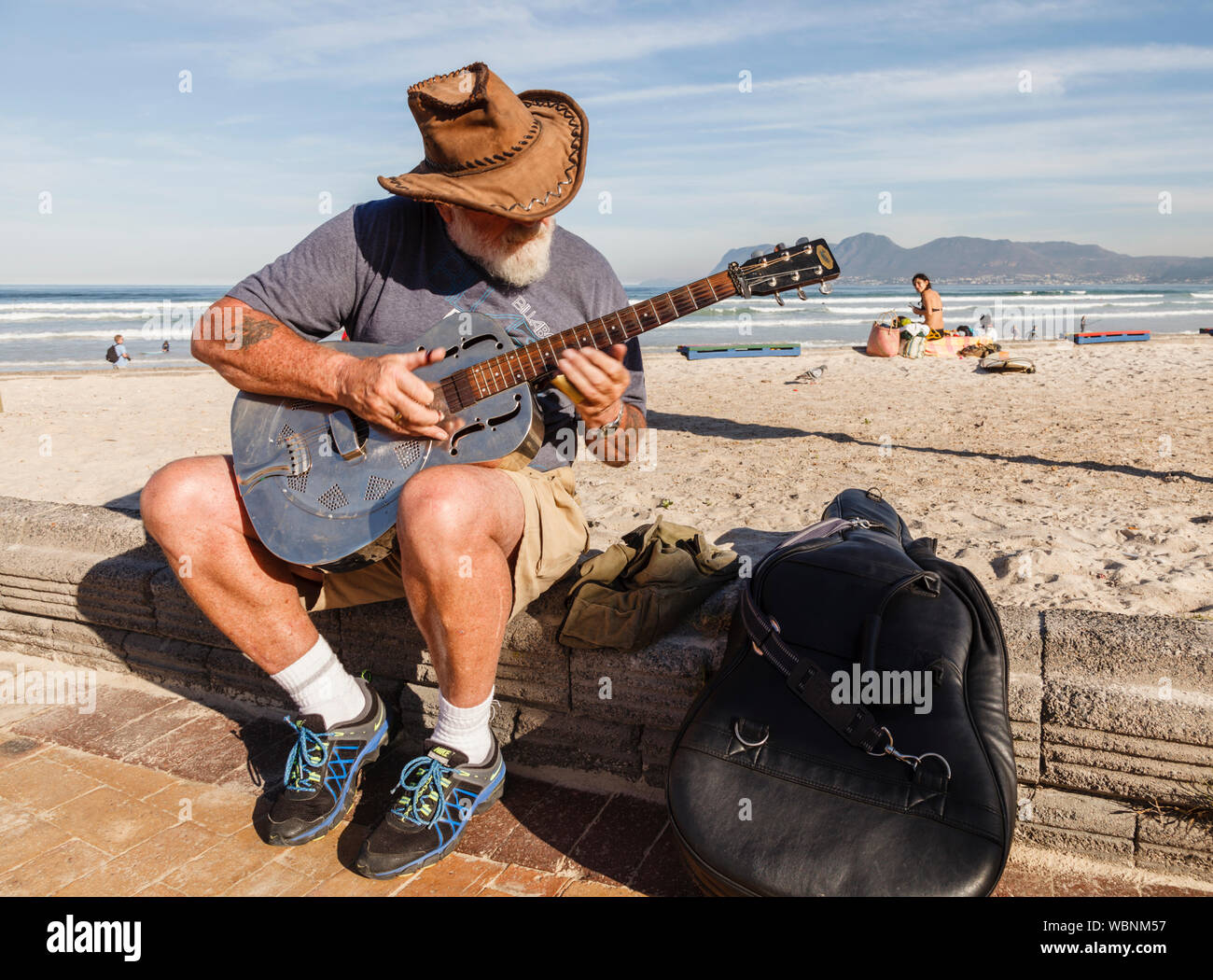 Busker on Muizenberg Beach, South Africa Stock Photo - Alamy