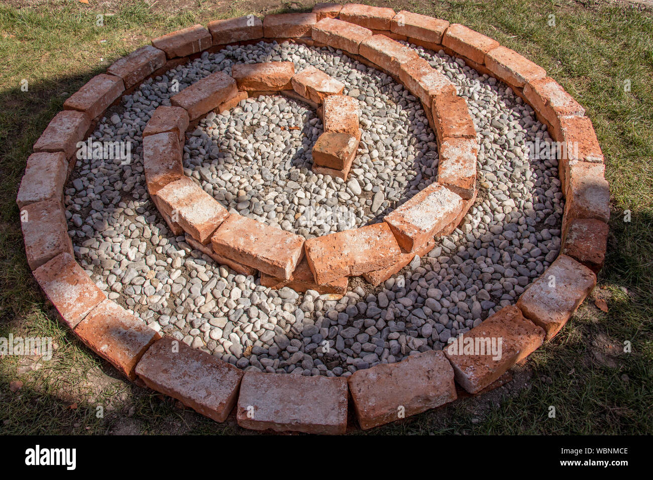 building herbal spiral first layer completed with pebbles Stock Photo ...