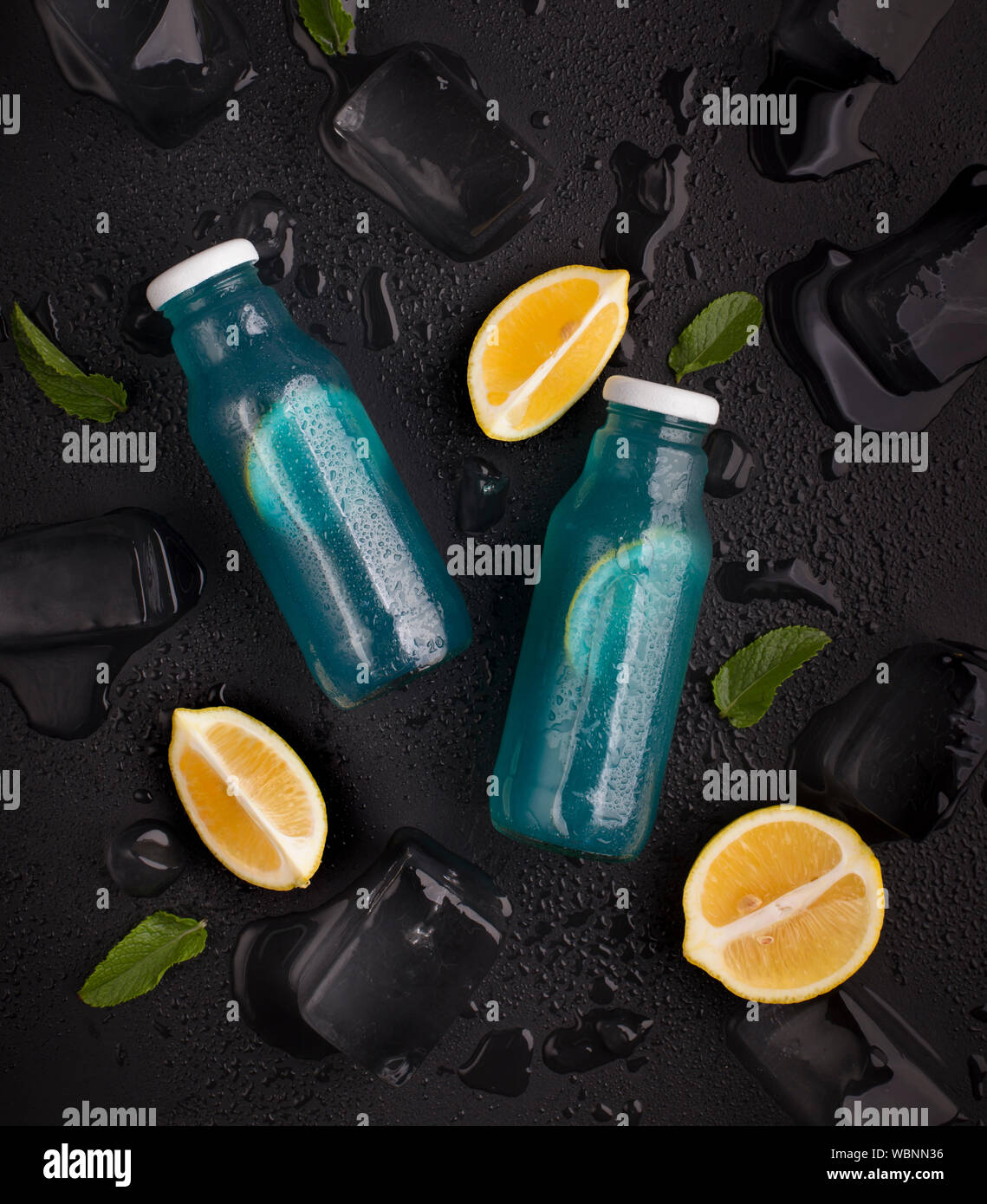 Creative composition of blue detox water with fresh lemon Stock Photo ...