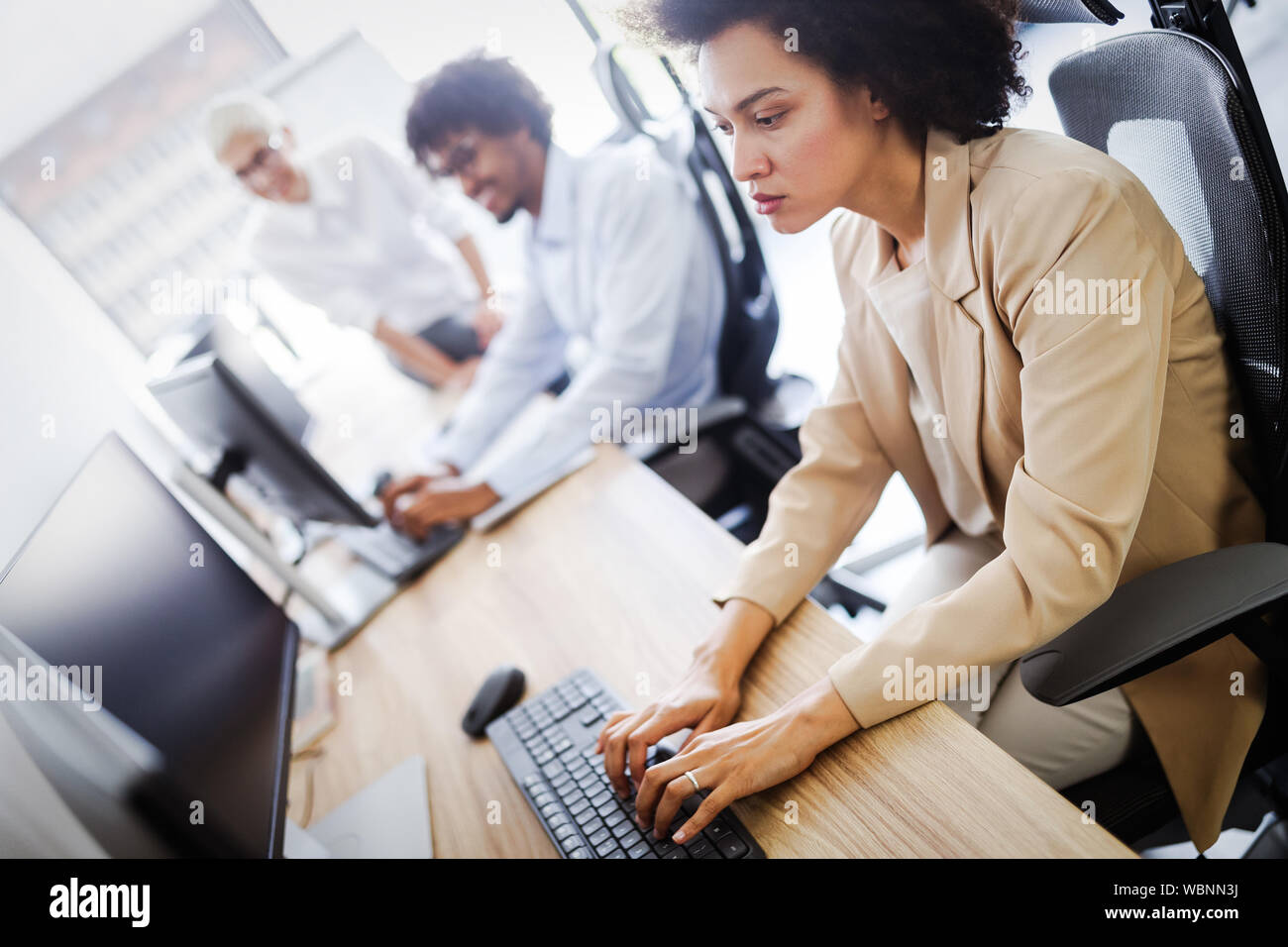 Group of successful business people at work in office Stock Photo - Alamy