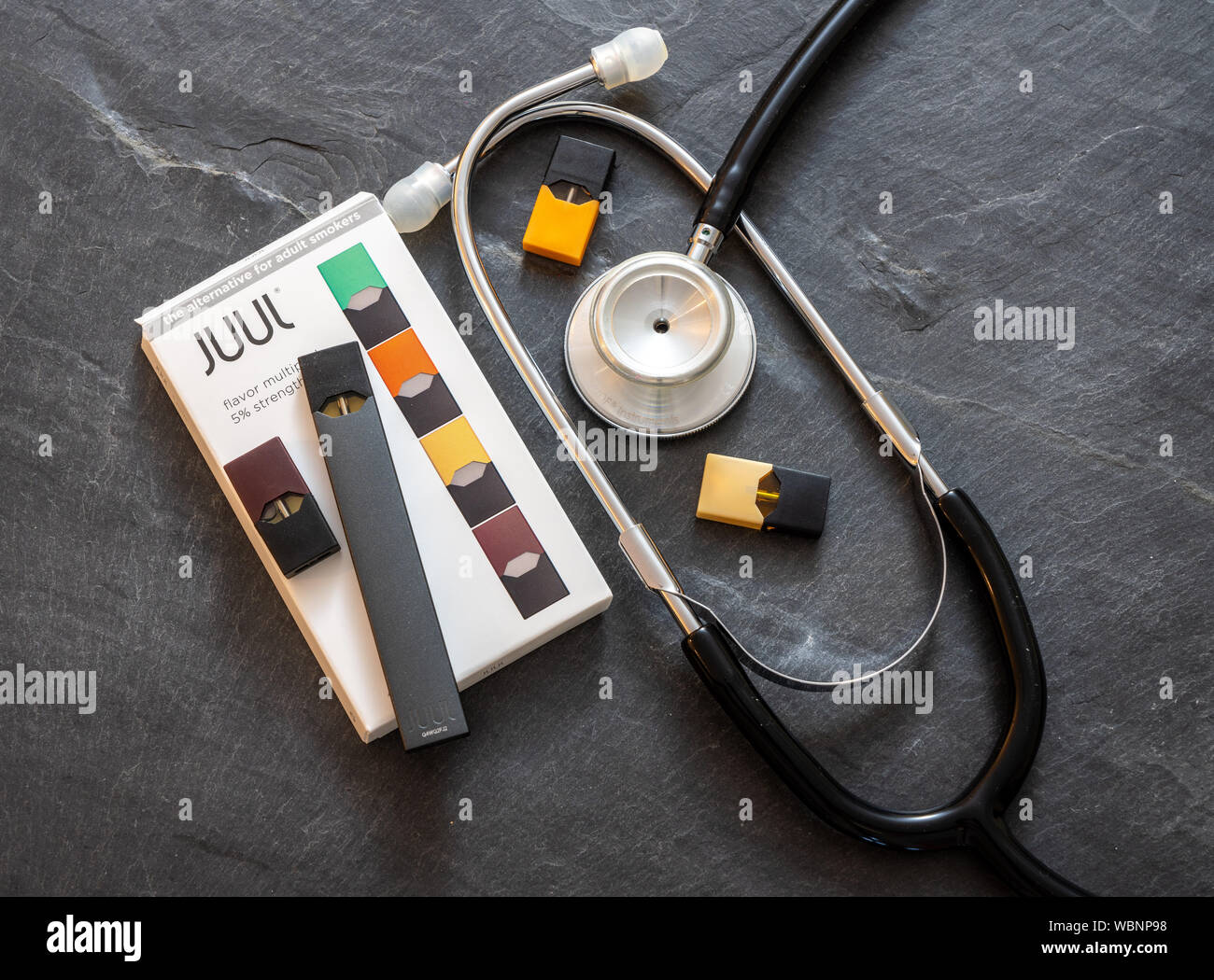 Box holding JUUL nicotine dispenser and pods with stethoscope Stock ...