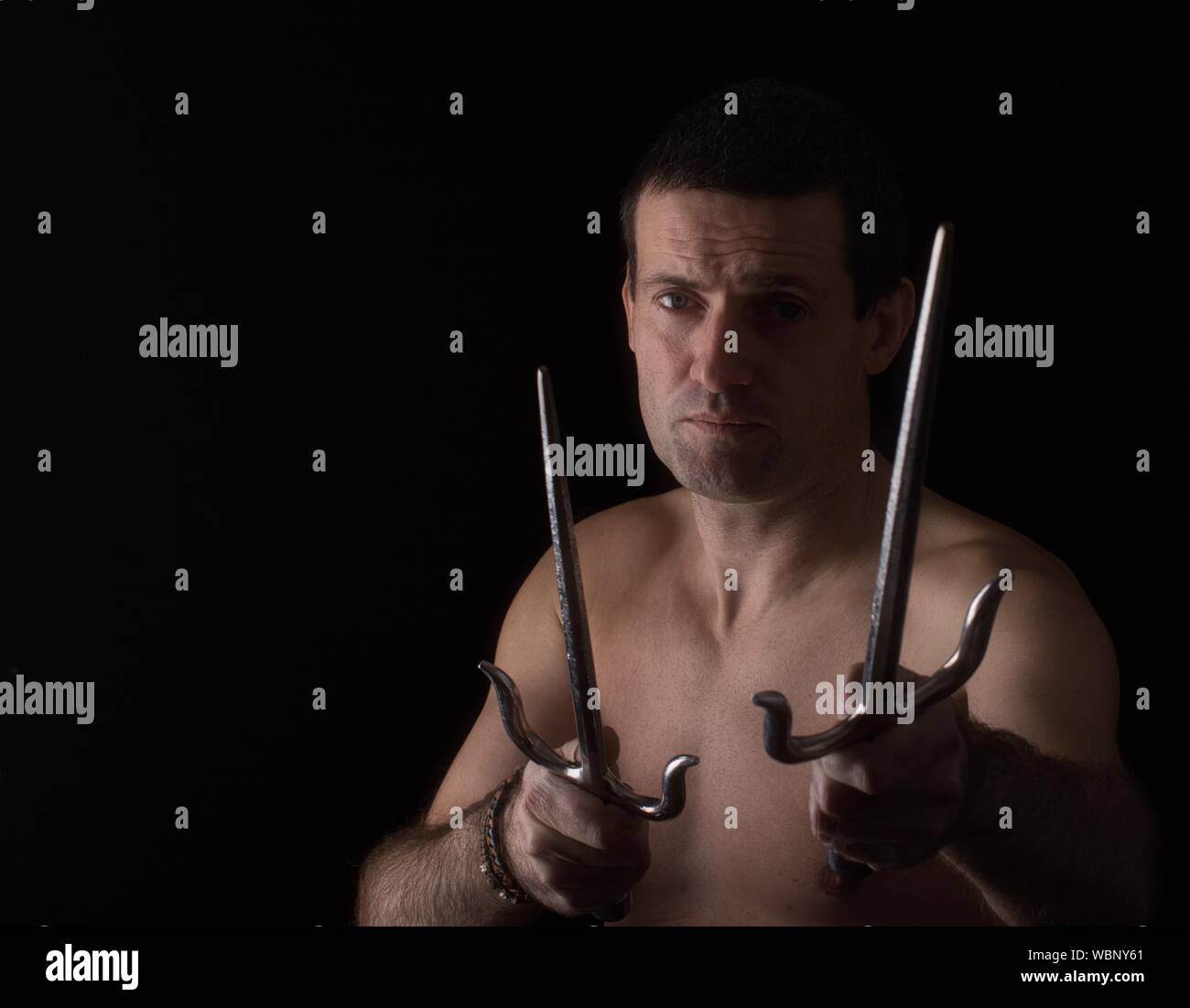 Men Holding Swords High Resolution Stock Photography and Images - Alamy