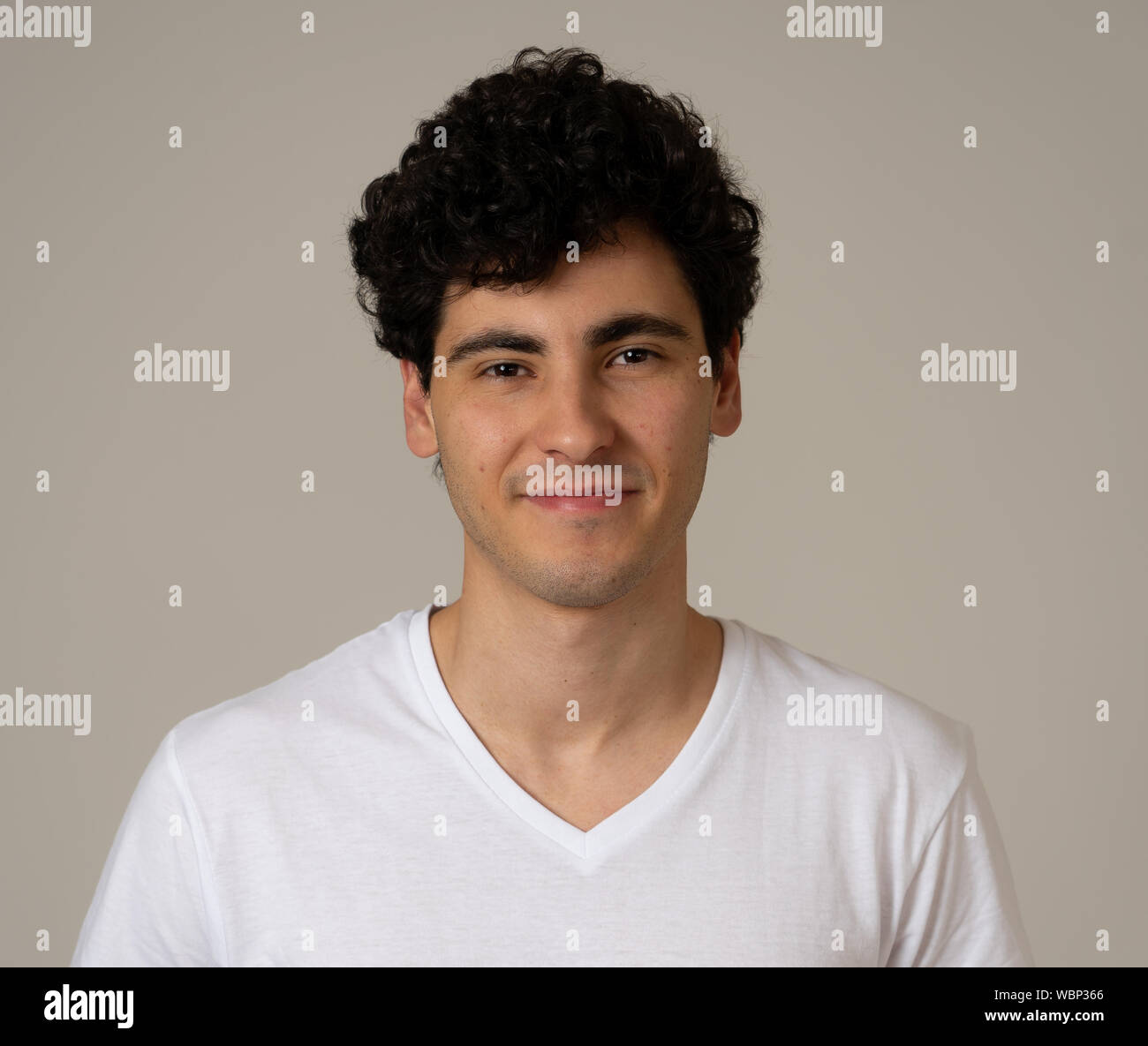 Close up portrait of attractive, confident young man looking neutral ...