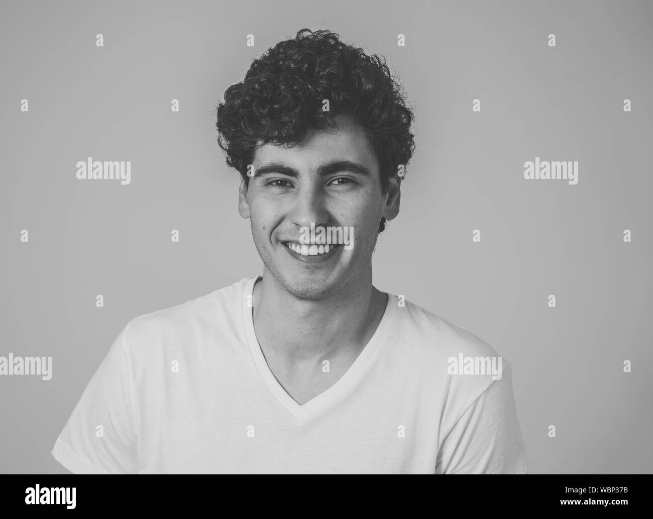 Close up portrait of happy young man having fun and joy smiling and ...
