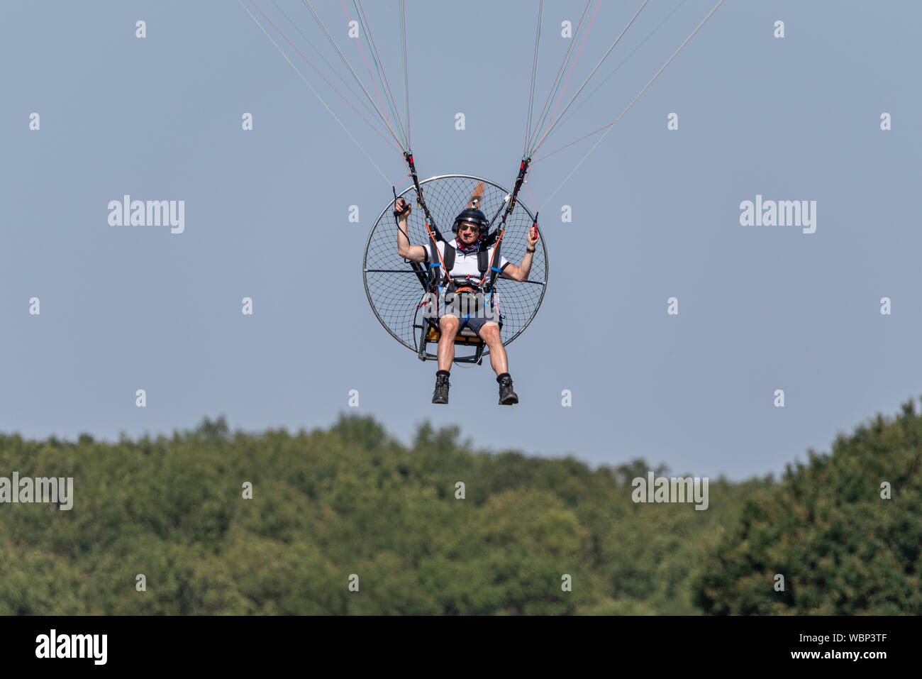 Powered paraglider, PPG, Paramotor pilot coming in to land at the ...