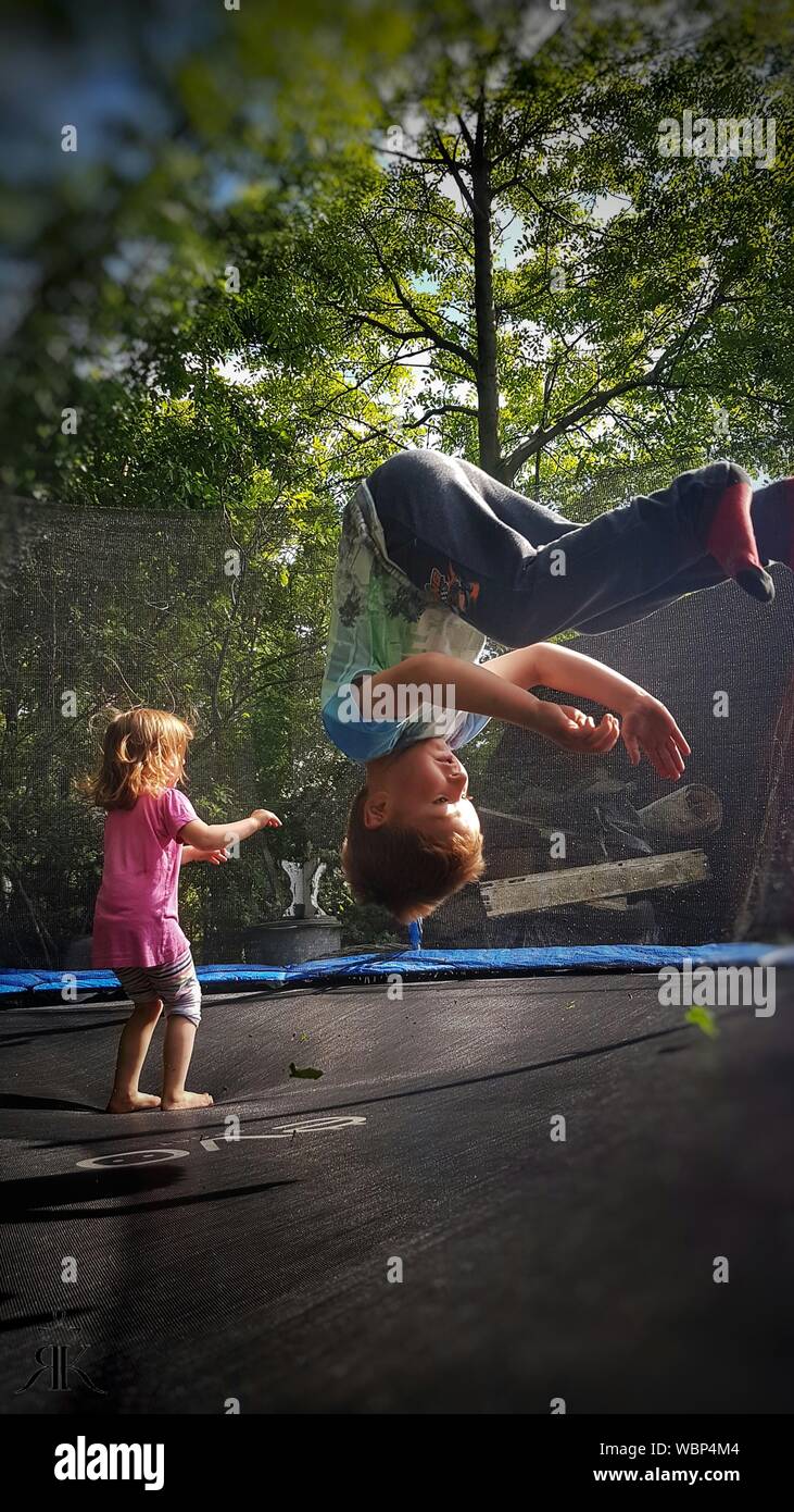 Two boys playing on trampoline hi-res stock photography and images - Alamy