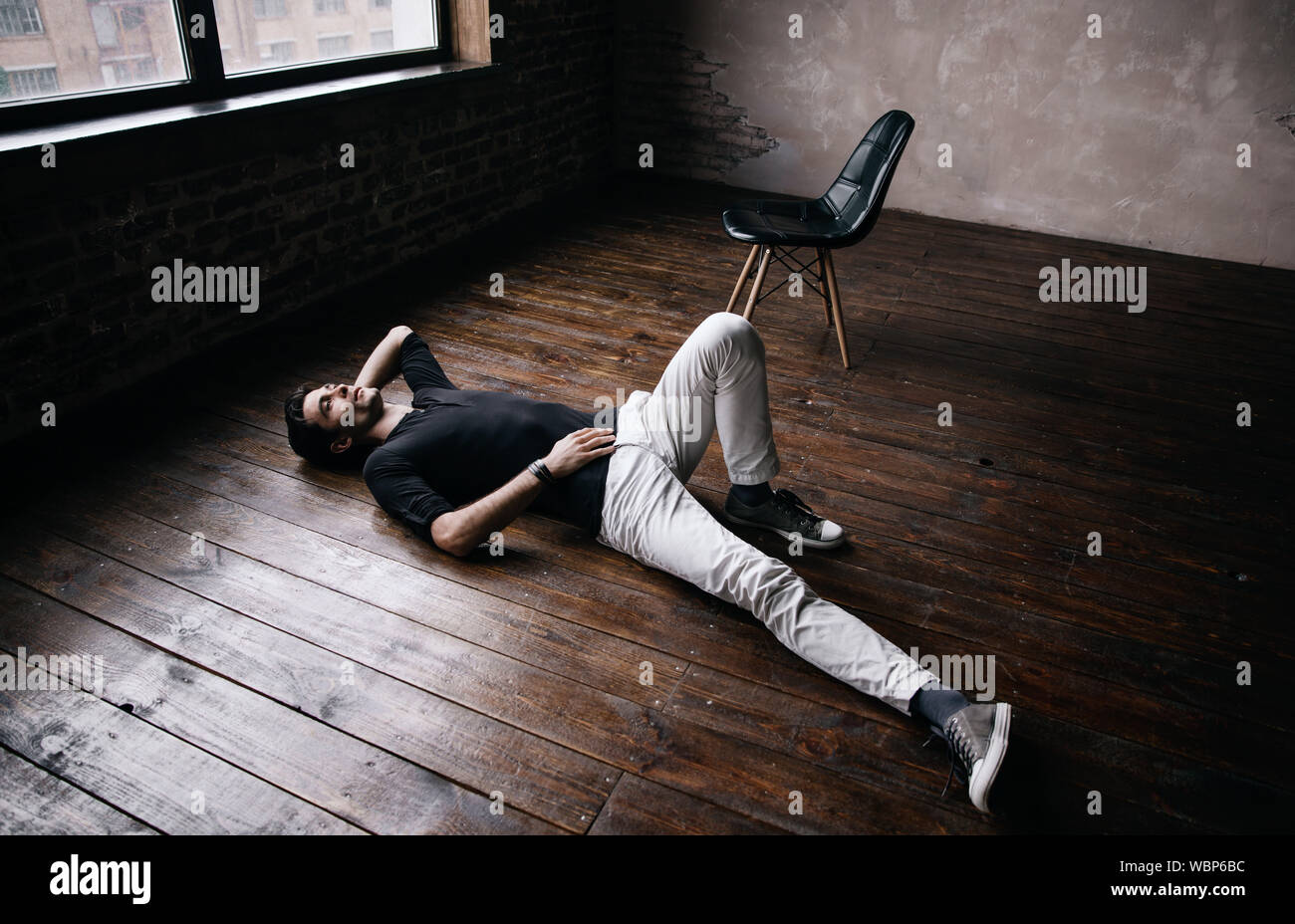 Man lying on the floor hi-res stock photography and images - Alamy