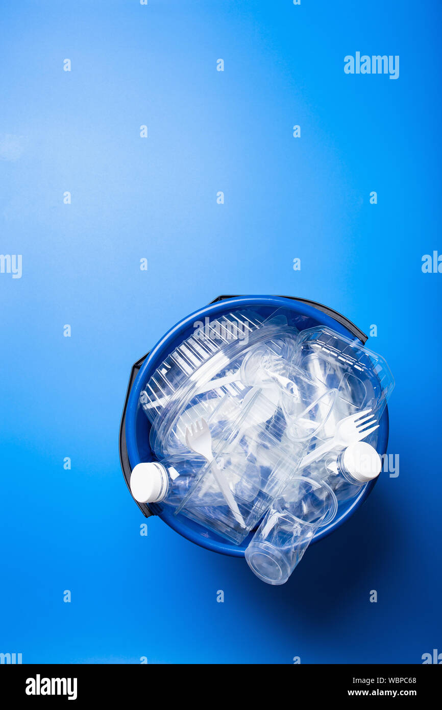 clean recyclable plastic bottles, containers, cups in garbage bin ...