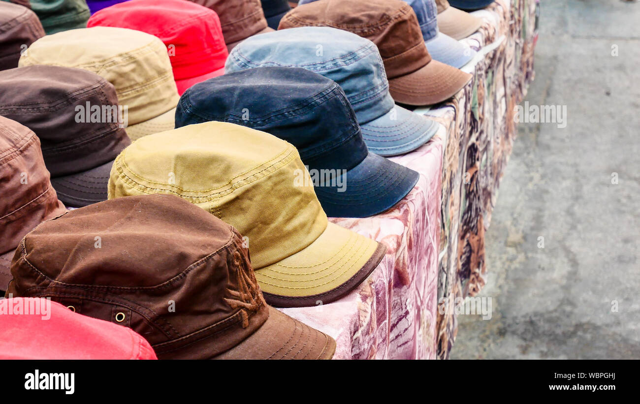 Caps stall hi-res stock photography and images - Alamy