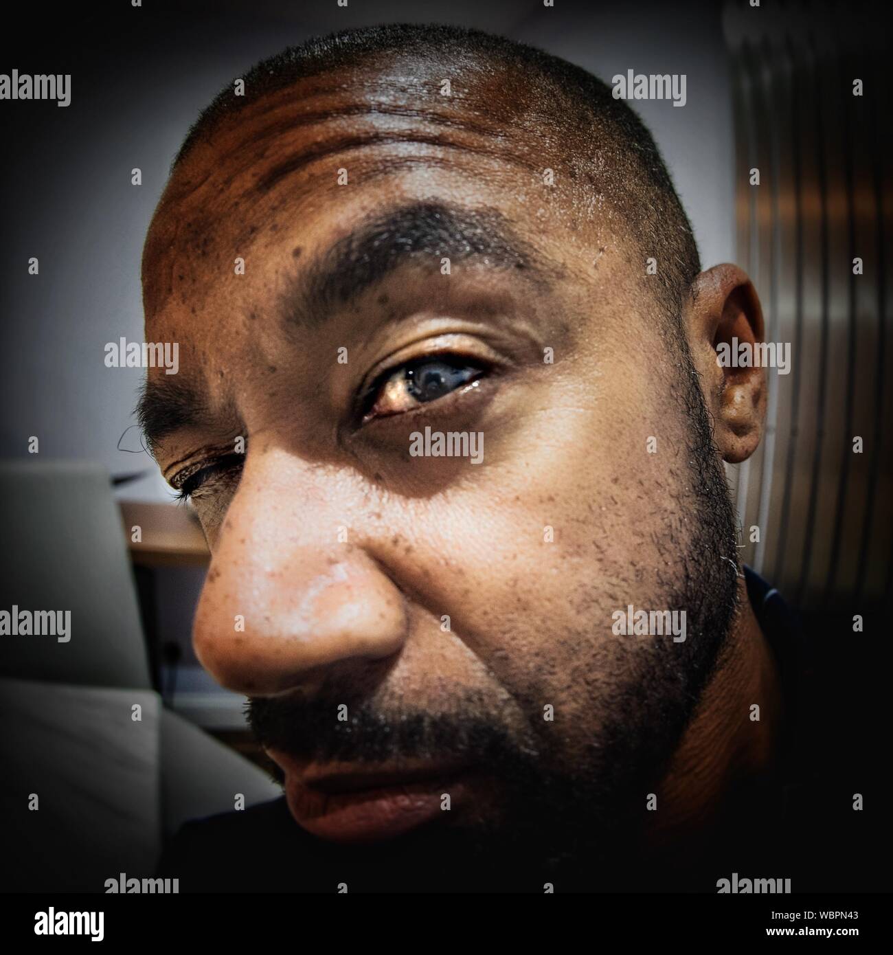 Winking man african american hi-res stock photography and images - Alamy
