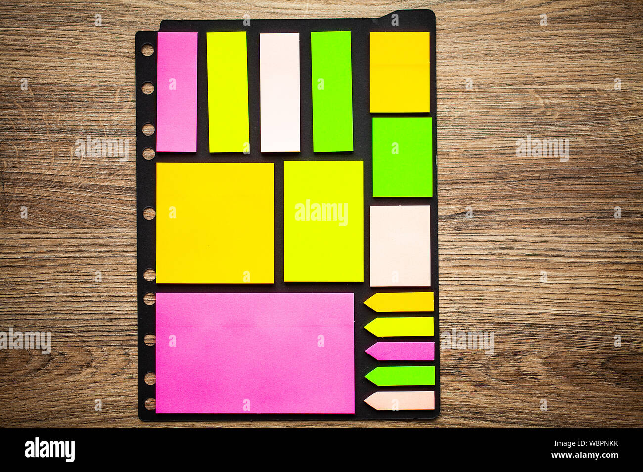 Collection colored sticky notes on wooden desk Stock Photo - Alamy