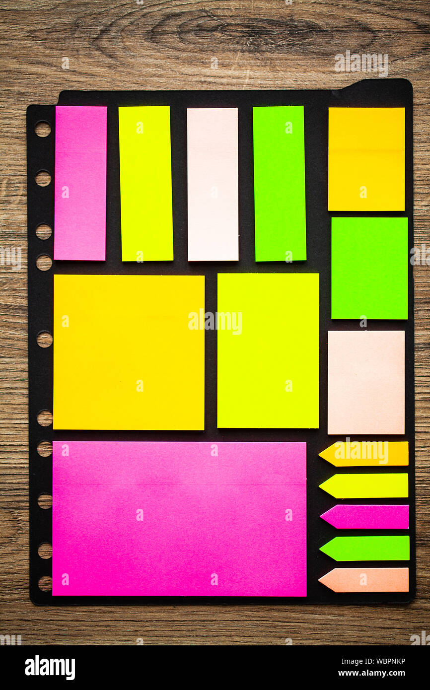 Collection colored sticky notes on wooden desk Stock Photo - Alamy